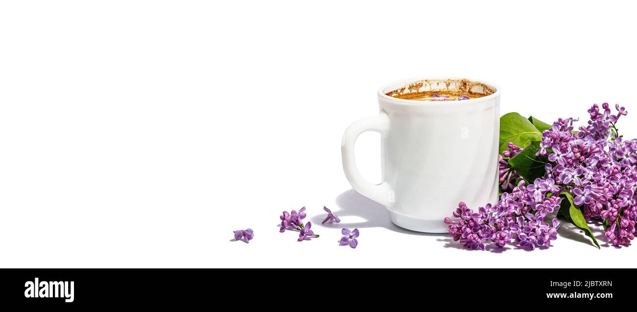 Cup of coffee and lilac flowers bouquet isolated on a white background ...