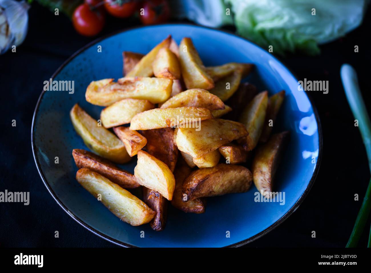 delicious home made wedges fries Stock Photo - Alamy