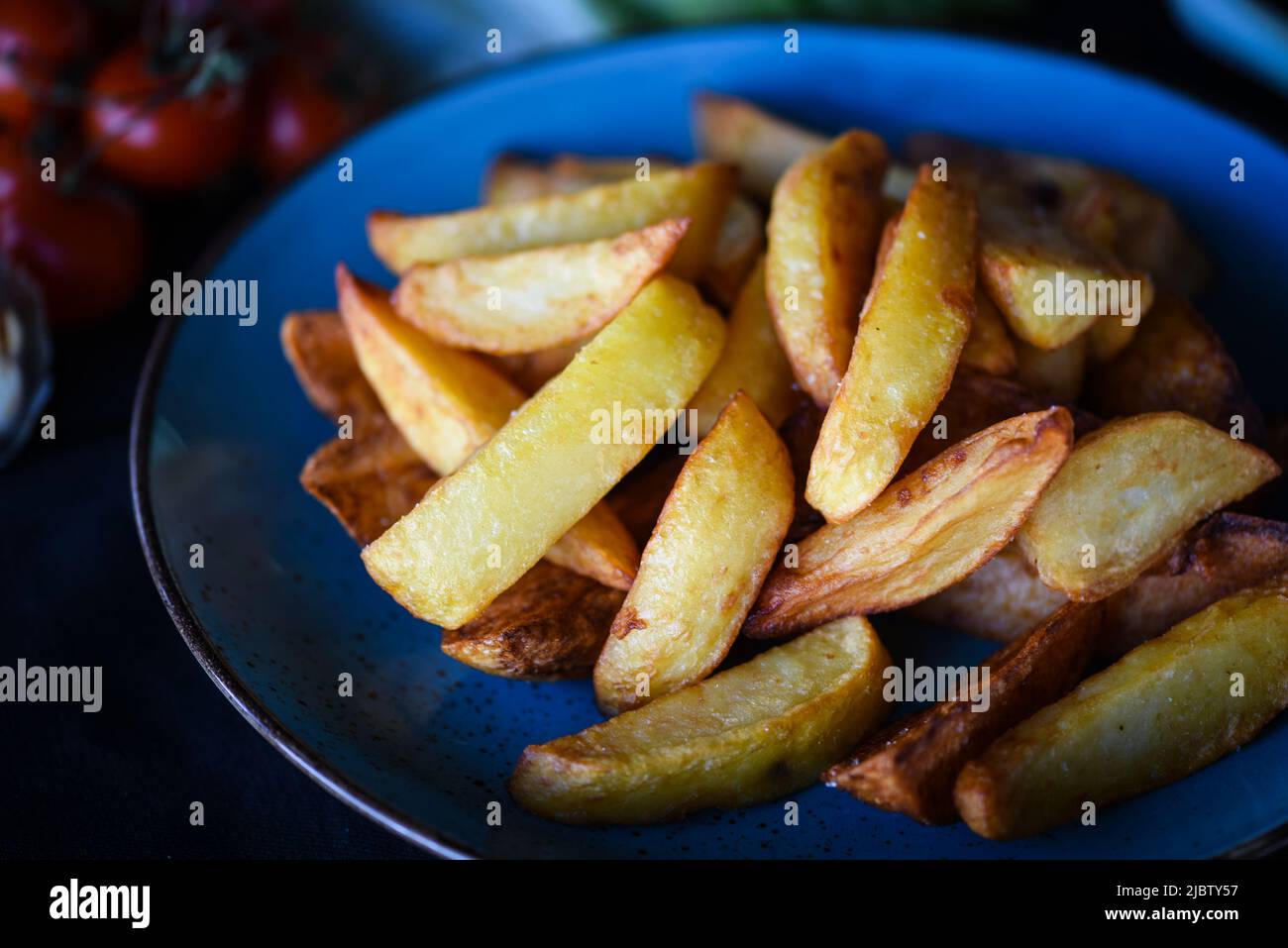 delicious home made wedges fries Stock Photo - Alamy