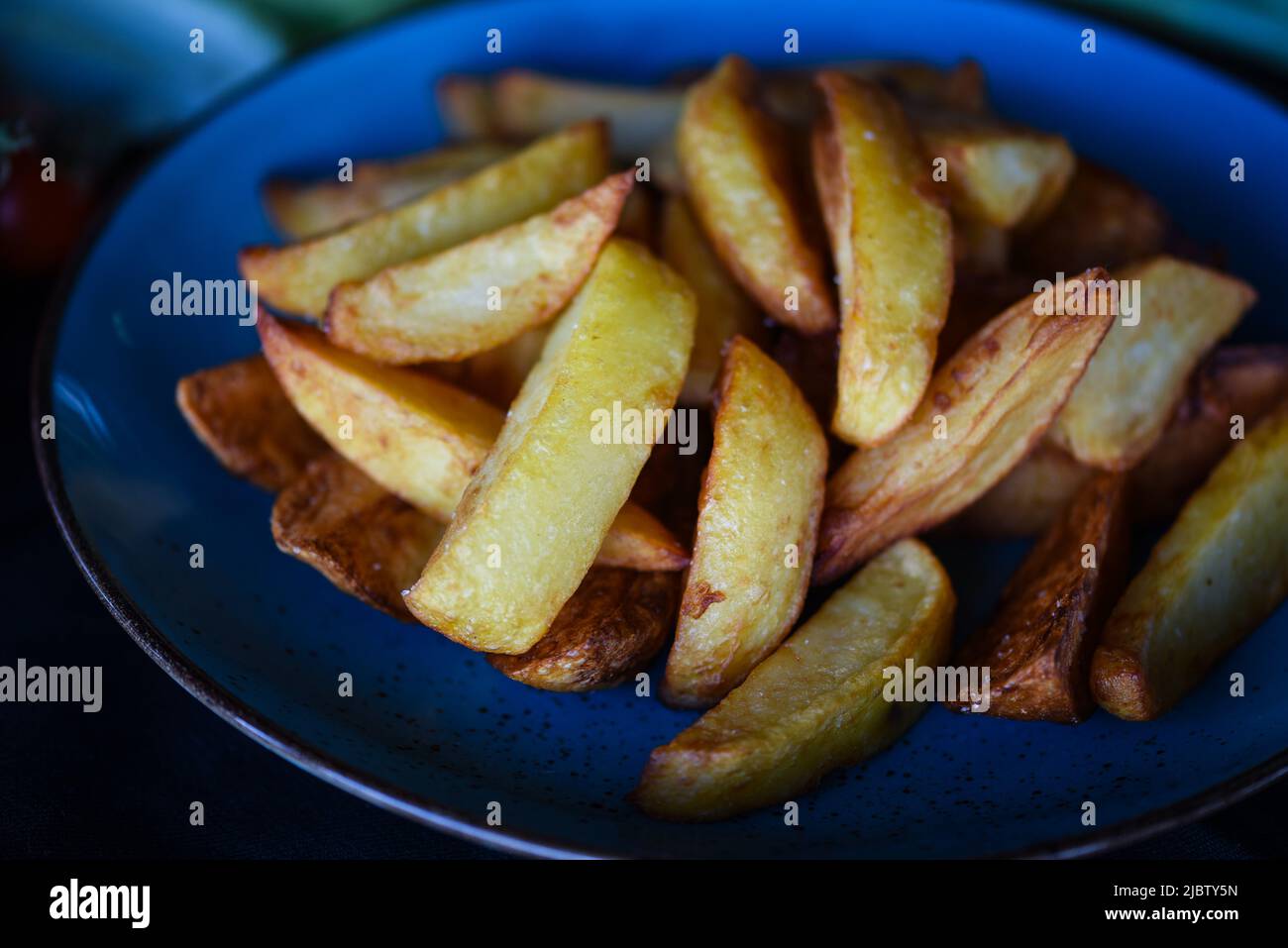 delicious home made wedges fries Stock Photo - Alamy