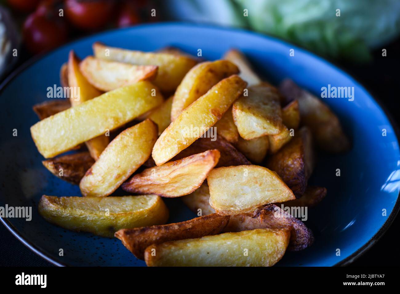 delicious home made wedges fries Stock Photo - Alamy