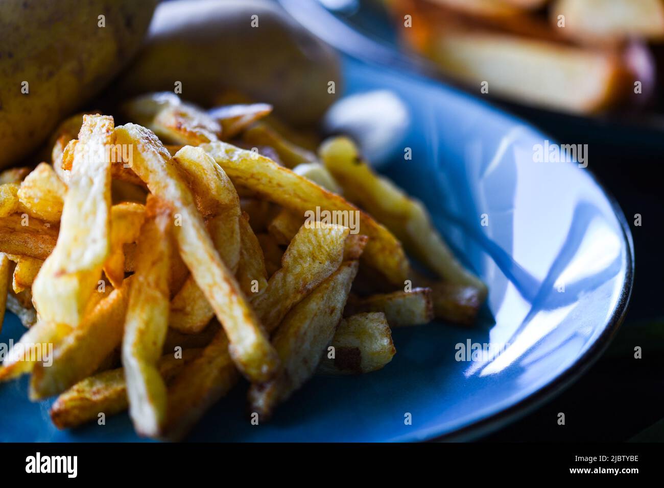 delicious home made wedges fries Stock Photo - Alamy