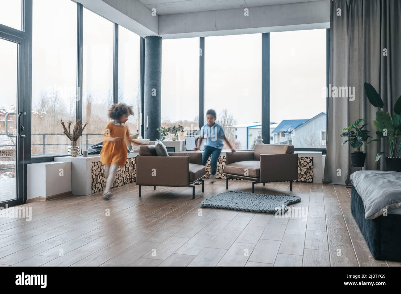 Siblings having fun together and dancing Stock Photo - Alamy