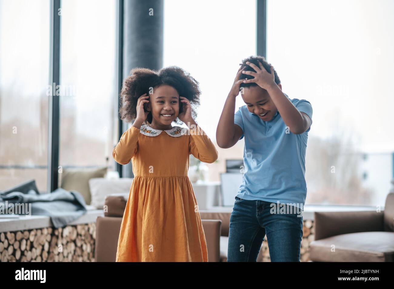Siblings having fun together and dancing Stock Photo - Alamy