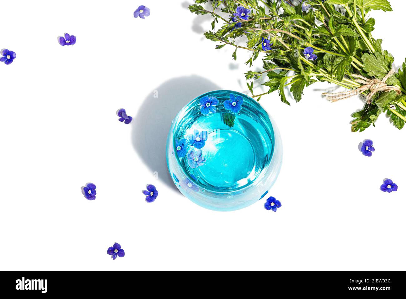 Cold tonic water and blue forget me not flowers bouquet isolated on a ...