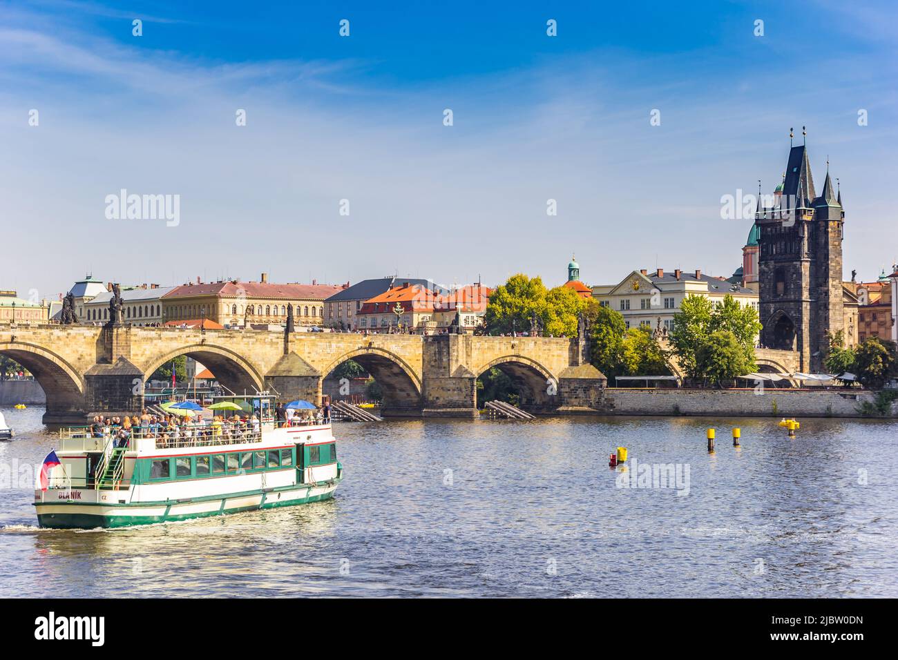 Tourists taking a boat ride on the river Moldau in Prague, Czech ...