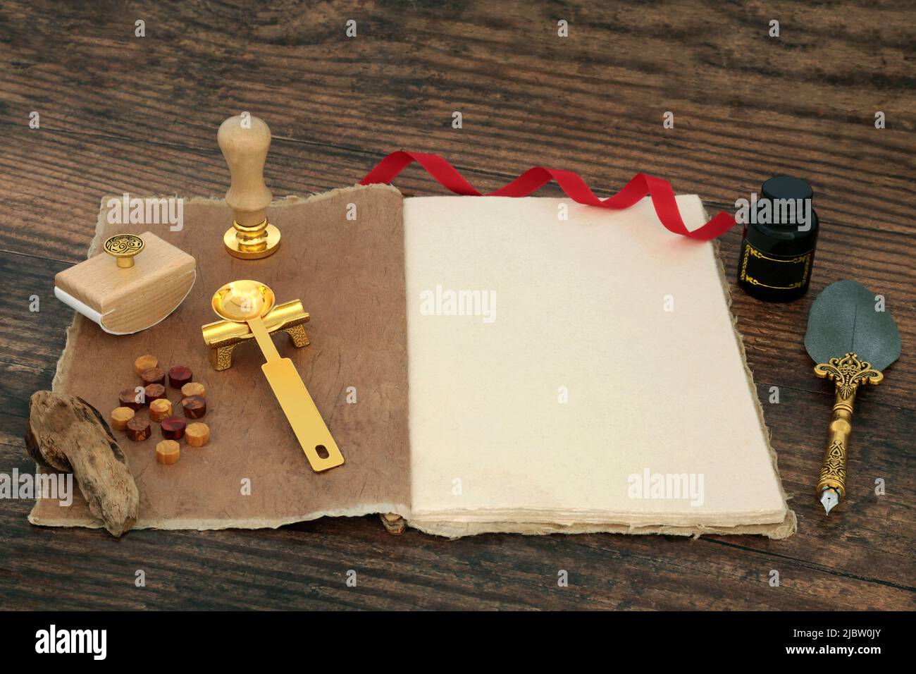 Retro writing composition with quill pen, blank hemp notebook, ink ...