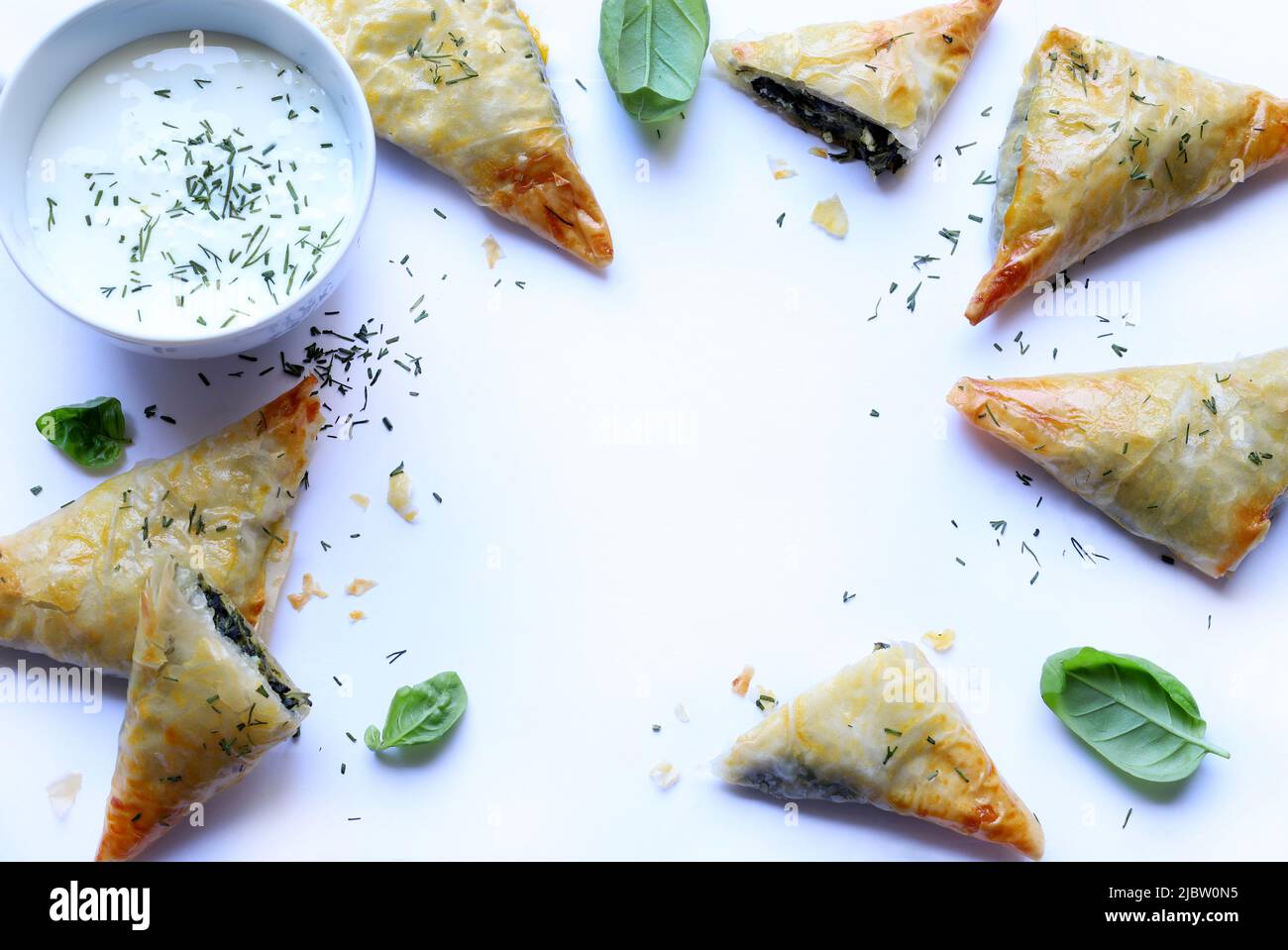 Traditional Greek cuisine. Spanakopita, crispy phyllo pastry triangles ...