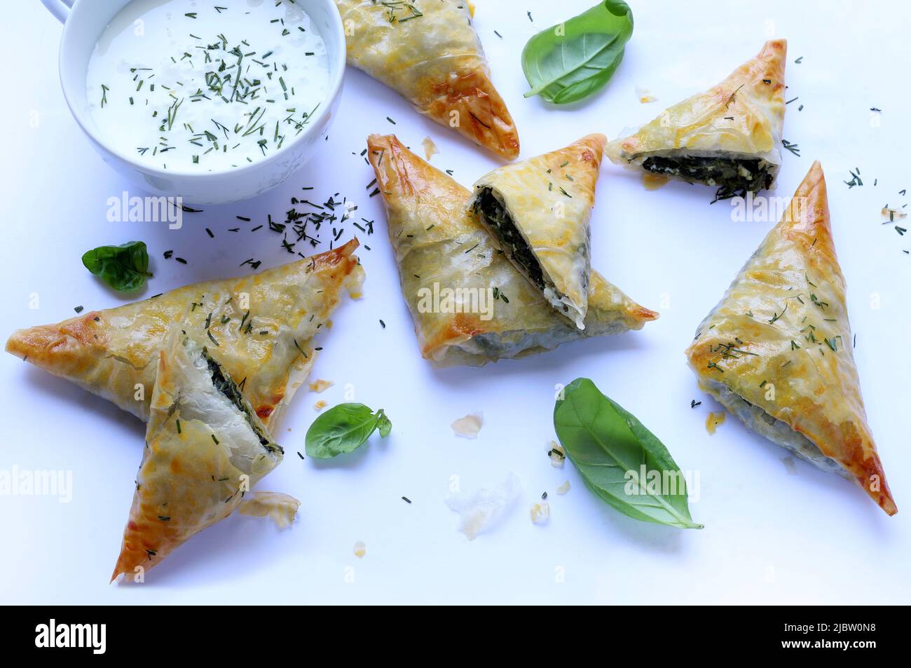 Traditional Greek cuisine. Spanakopita, crispy phyllo pastry triangles ...