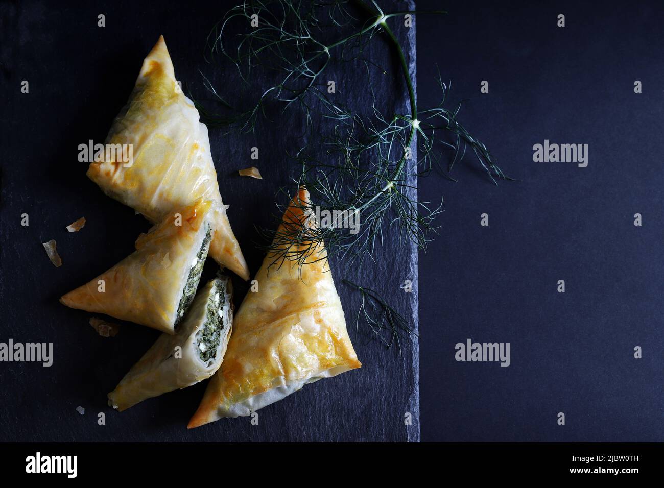 Spanakopita, crispy phyllo pastry triangles with spinach, feta and dill ...