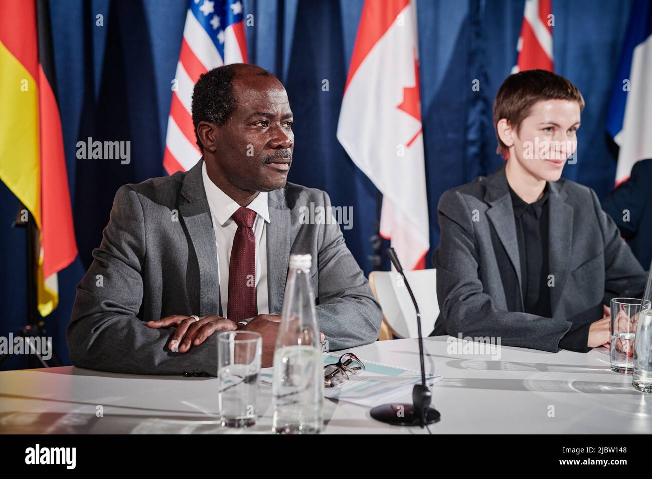 Sitting meeting conference table authority politician hi-res stock ...