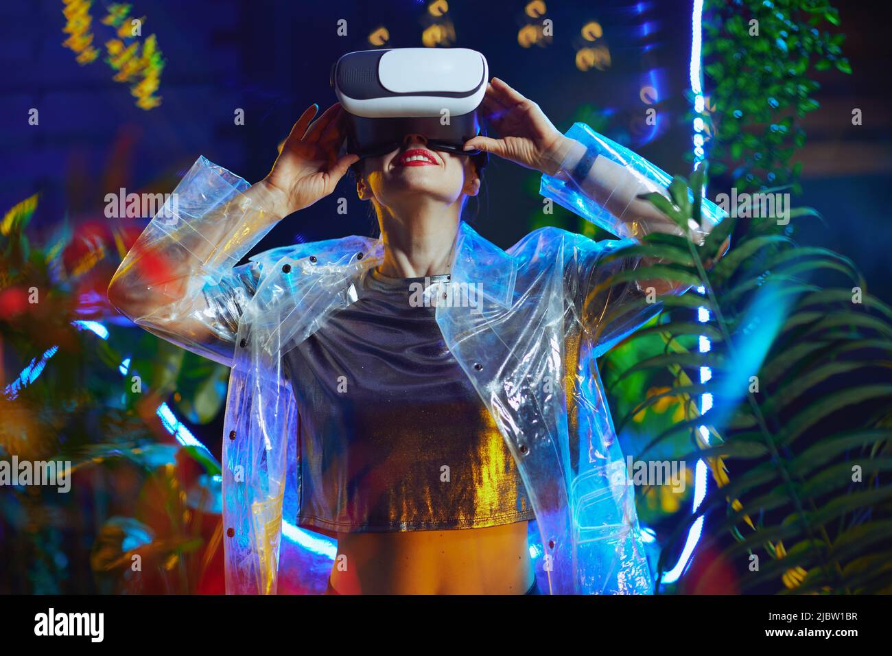 happy modern woman in metaverse in vr goggles Stock Photo - Alamy