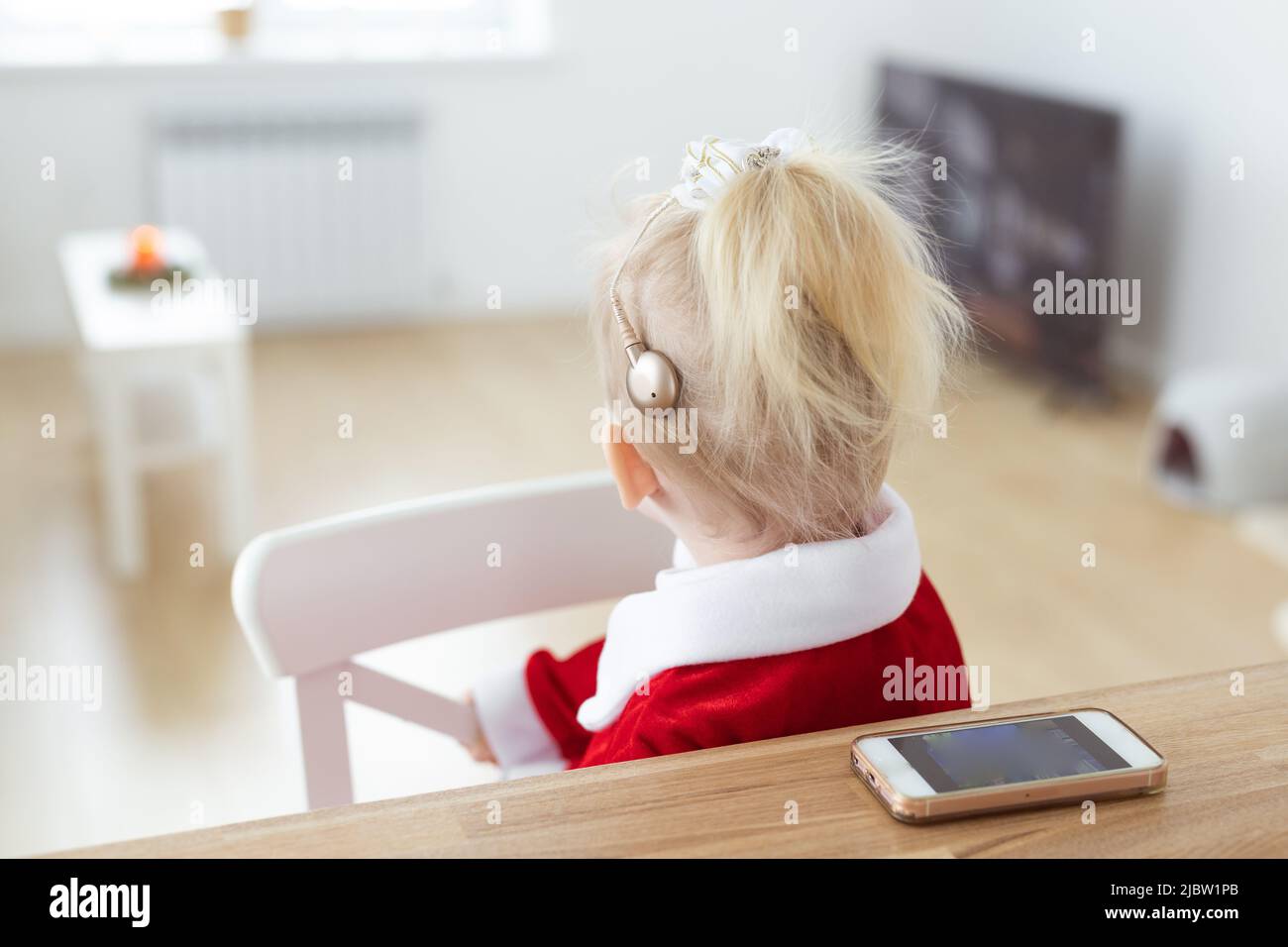 Deaf child girl with cochlear implant on living room - deafness ...