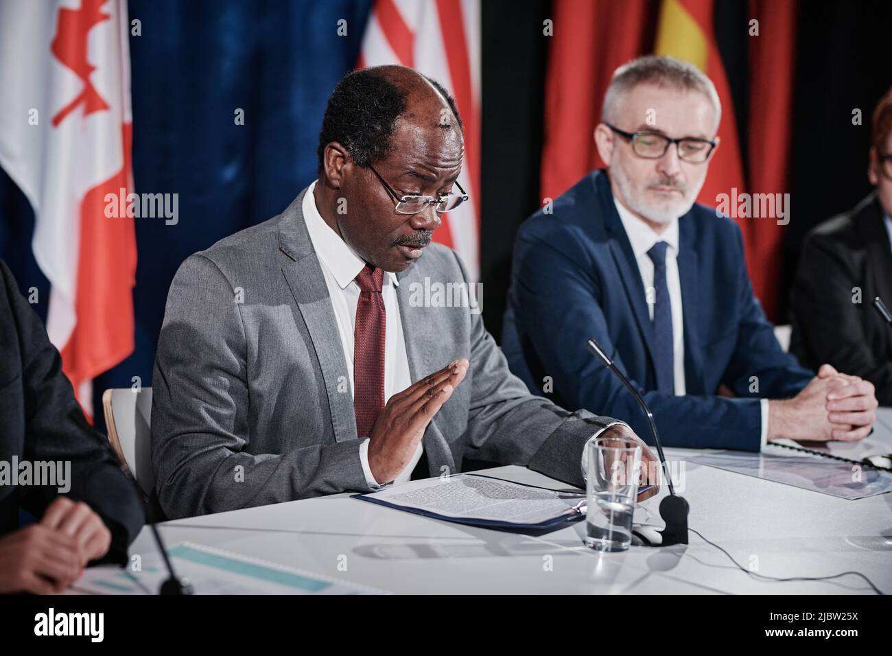 African man reading into microphone hi-res stock photography and images ...