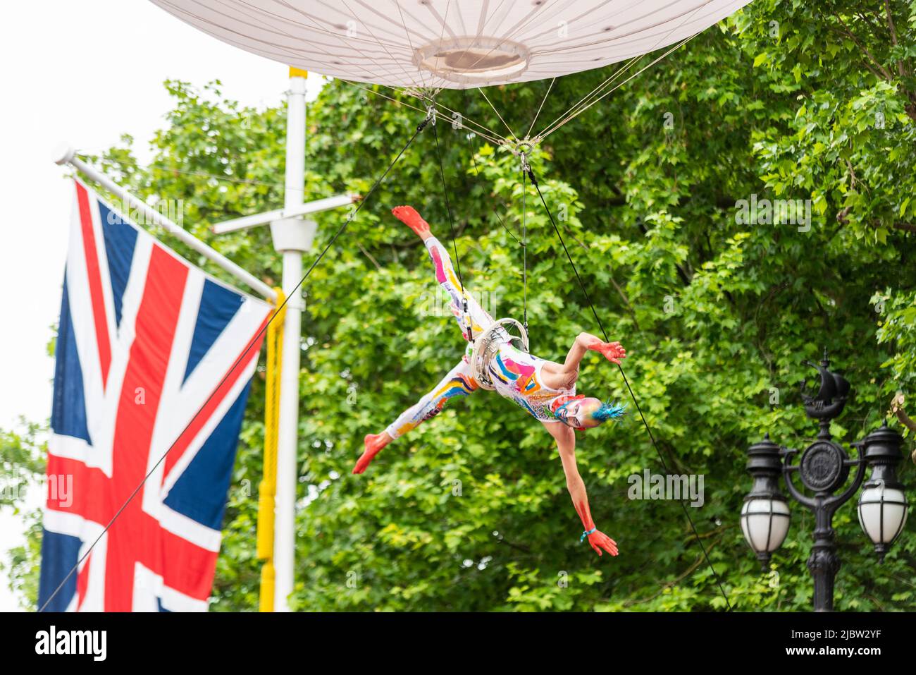 Male acrobat performing at the Queen's Platinum Jubilee Pageant parade ...