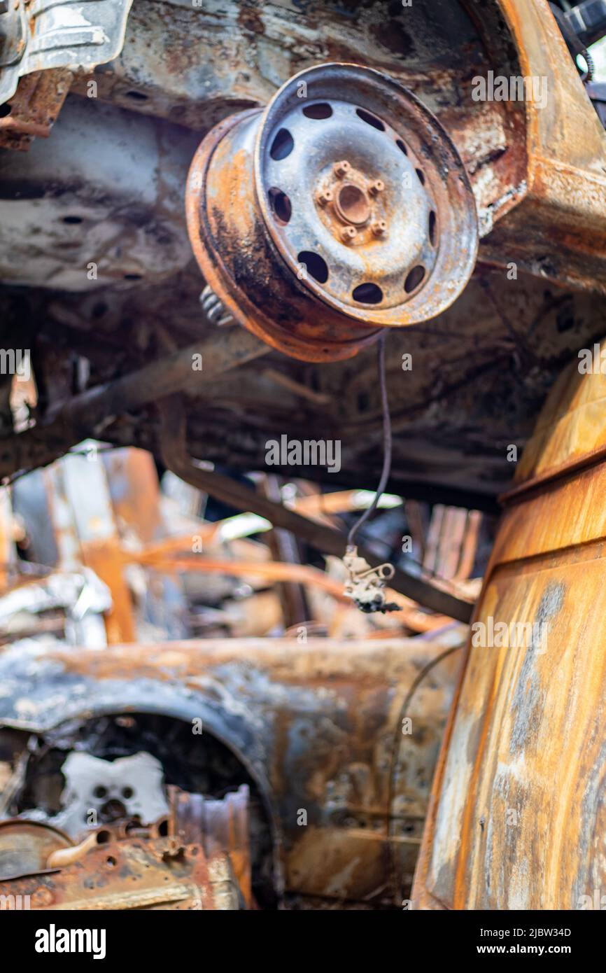 The car was completely destroyed by fire. Abandoned, burnt and rusty ...