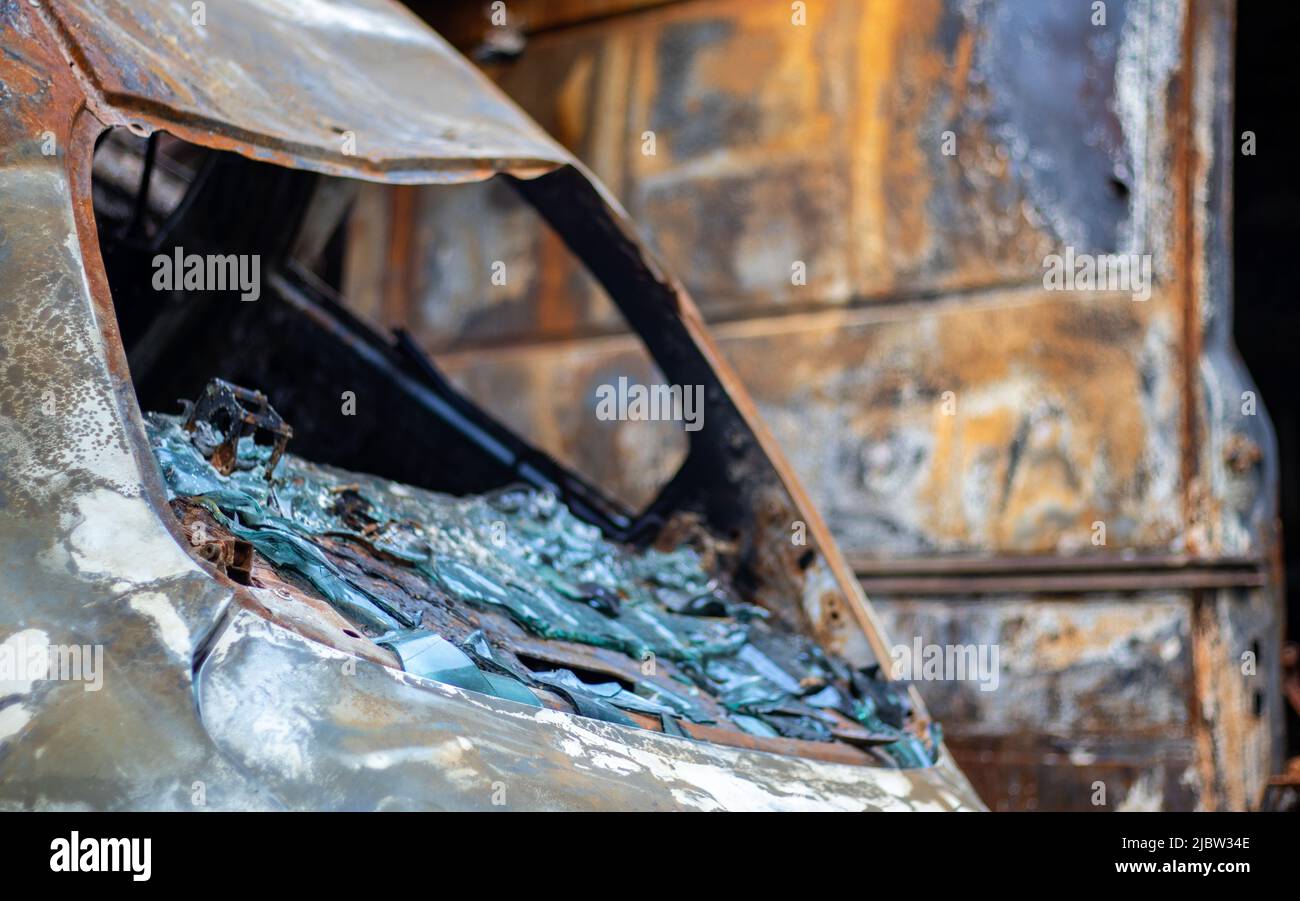 The car was completely destroyed by fire. Abandoned, burnt and rusty ...