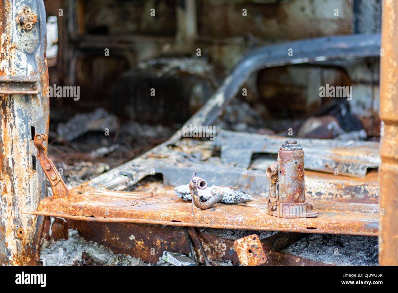 The car was completely destroyed by fire. Abandoned, burnt and rusty ...