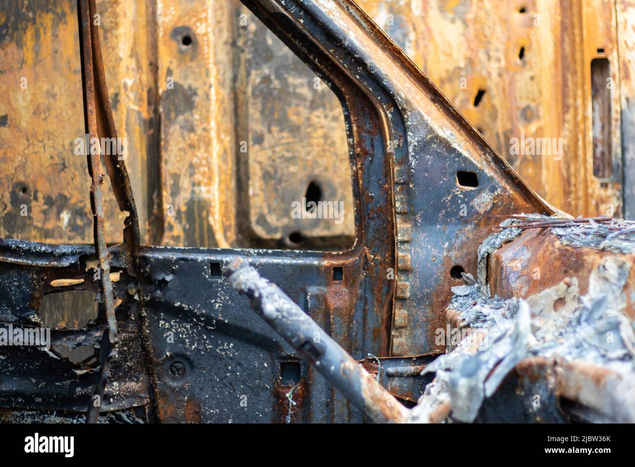 The car was completely destroyed by fire. Abandoned, burnt and rusty ...