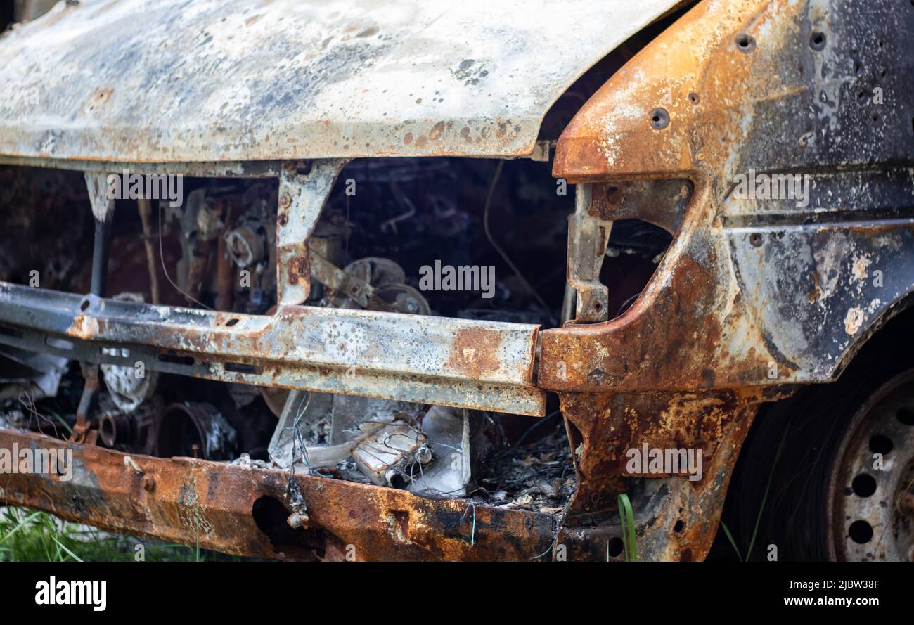 The car was completely destroyed by fire. Abandoned, burnt and rusty ...
