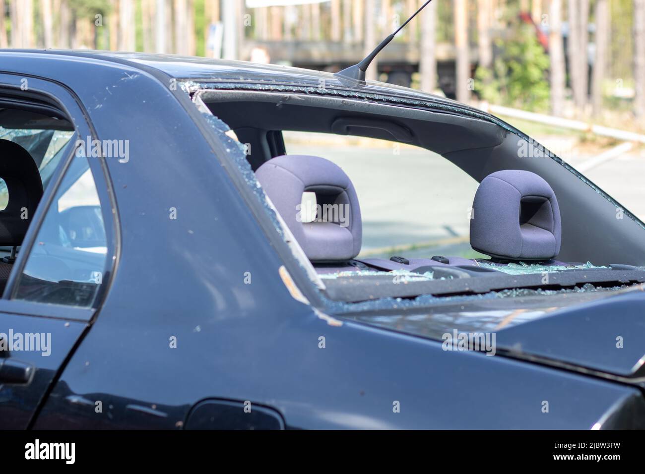 A car after an accident with a broken rear window. Broken window in a ...