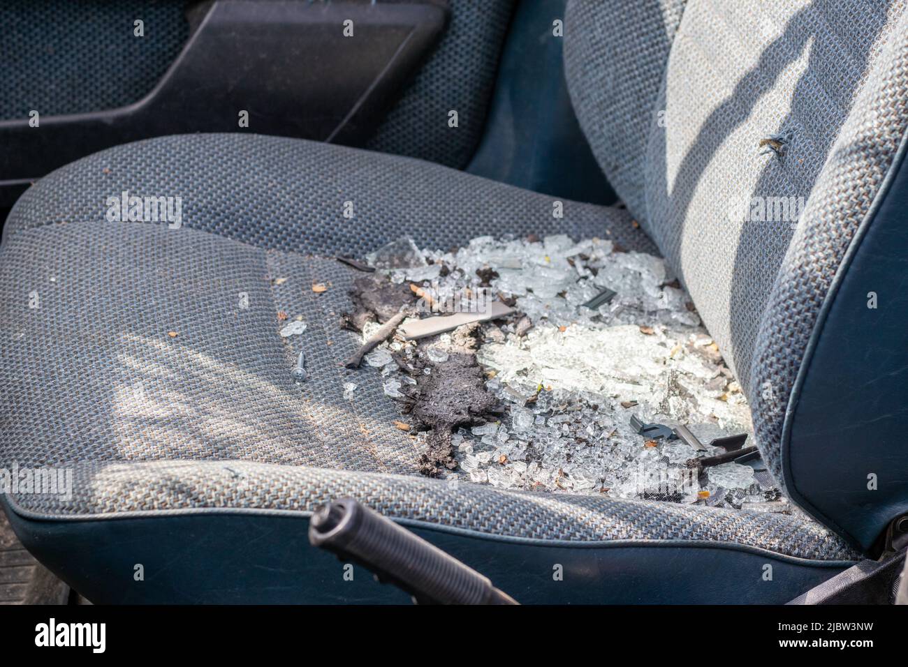The interior of the car is damaged after the accident, broken glass on ...