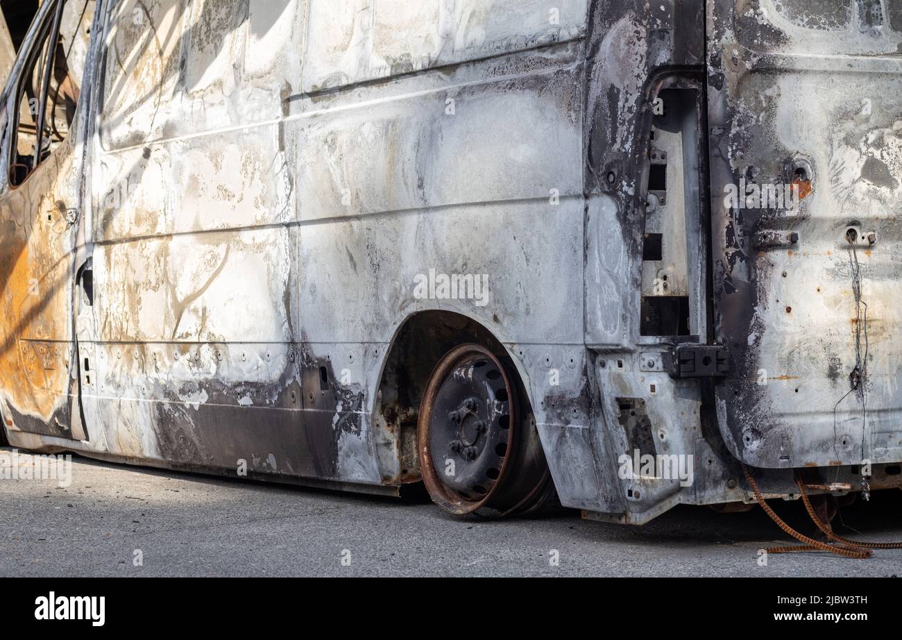 Cars after the fire. Iron parts of a burnt car. Burnt-out cars ...