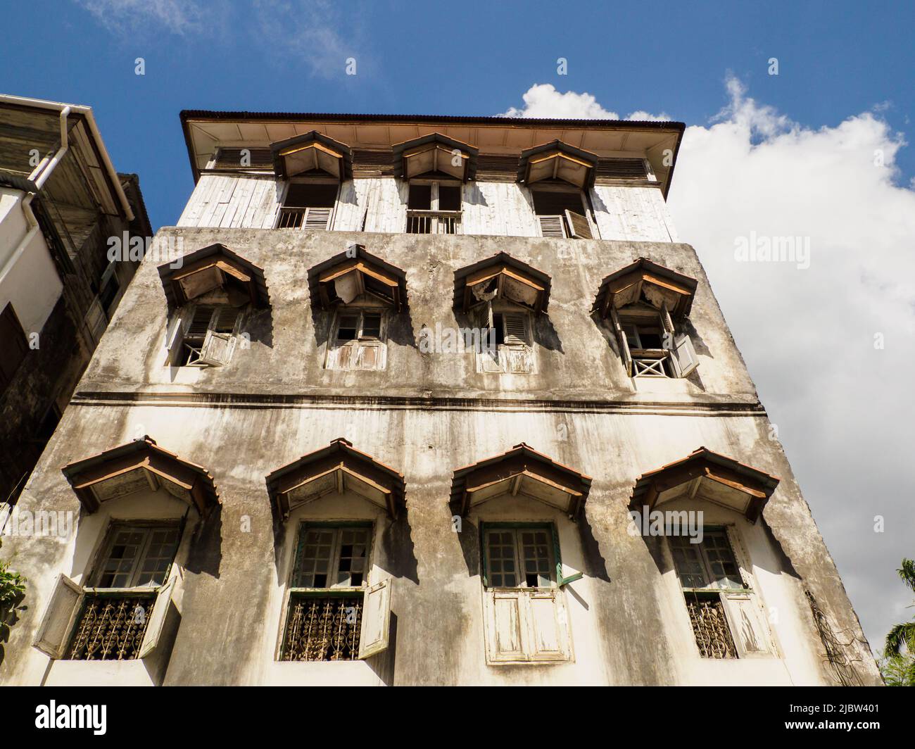 Stone Town, Zanzibar - Feb. 2021: View up tp the sky between narrow ...