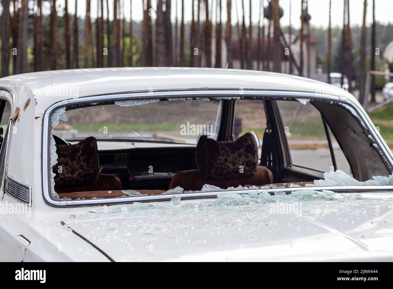 A car after an accident with a broken rear window. Broken window in a ...