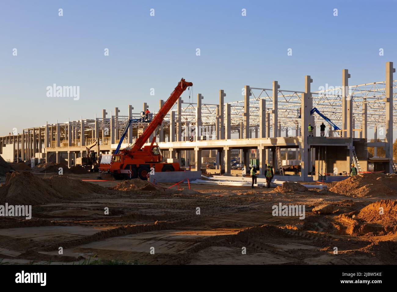 Industrial construction site. Crane build construction plant from steel ...