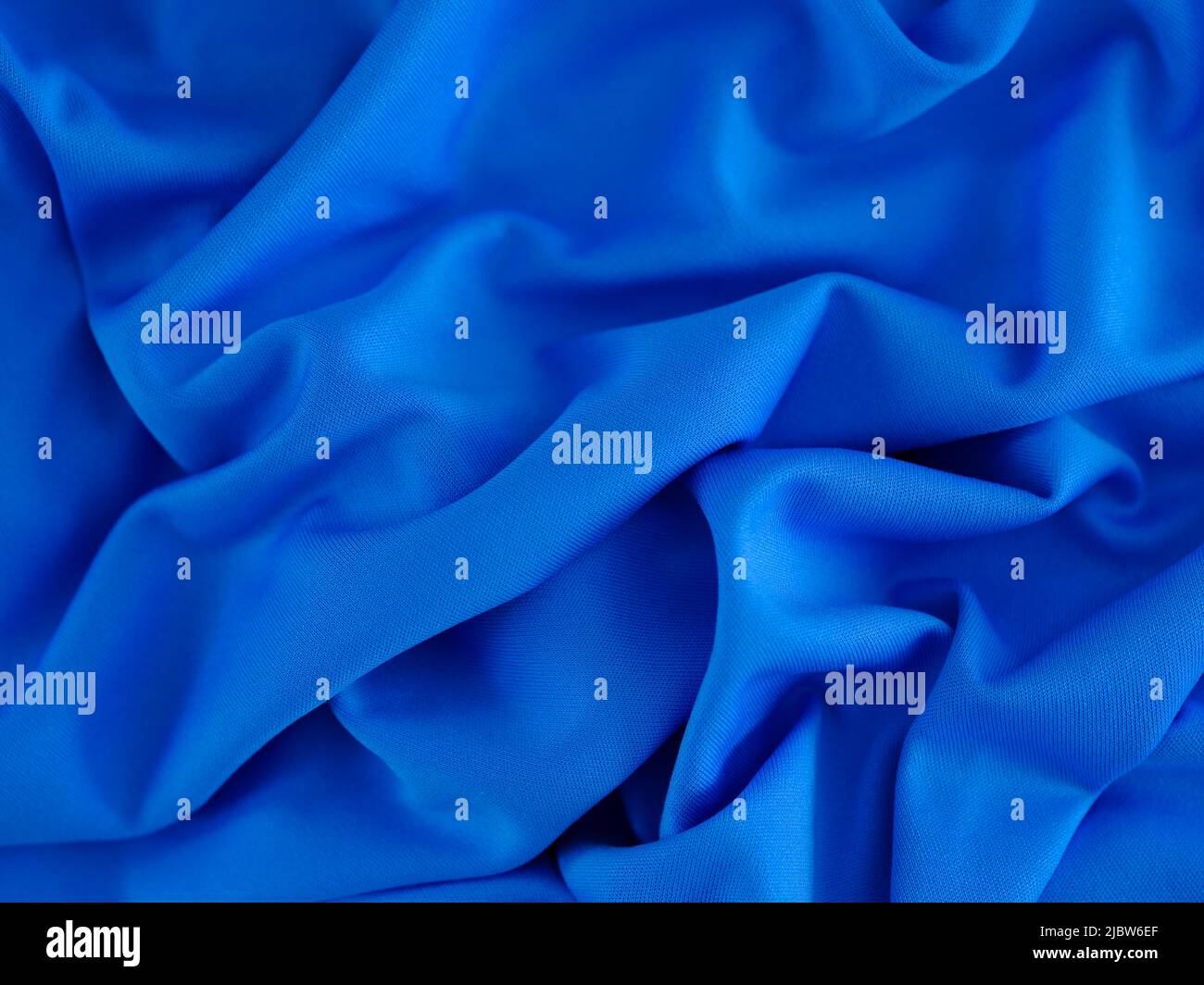 A blue wrinkled fabric texture background. Close up Stock Photo - Alamy