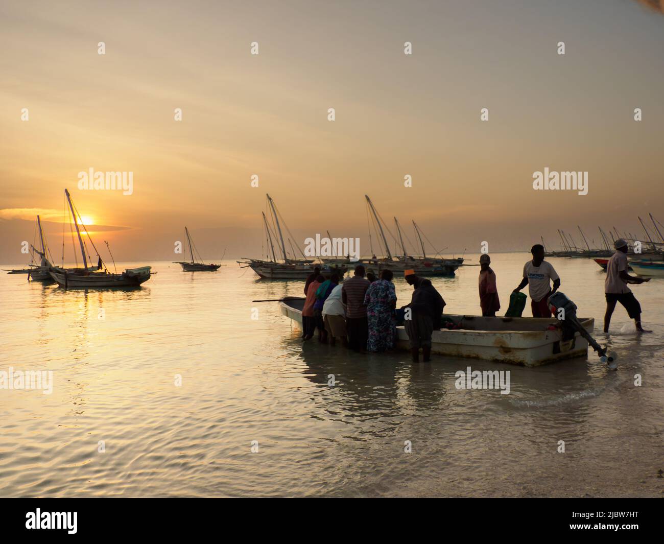 Zanzibar, Tanzania - Jan, 2021: Fishermen collecting fish from wooden ...