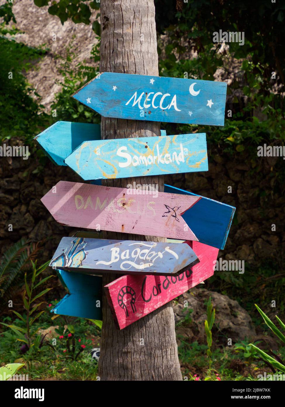 Kizimkazi, Tanzania - January 2021: Signposts on colorful wooden plates ...