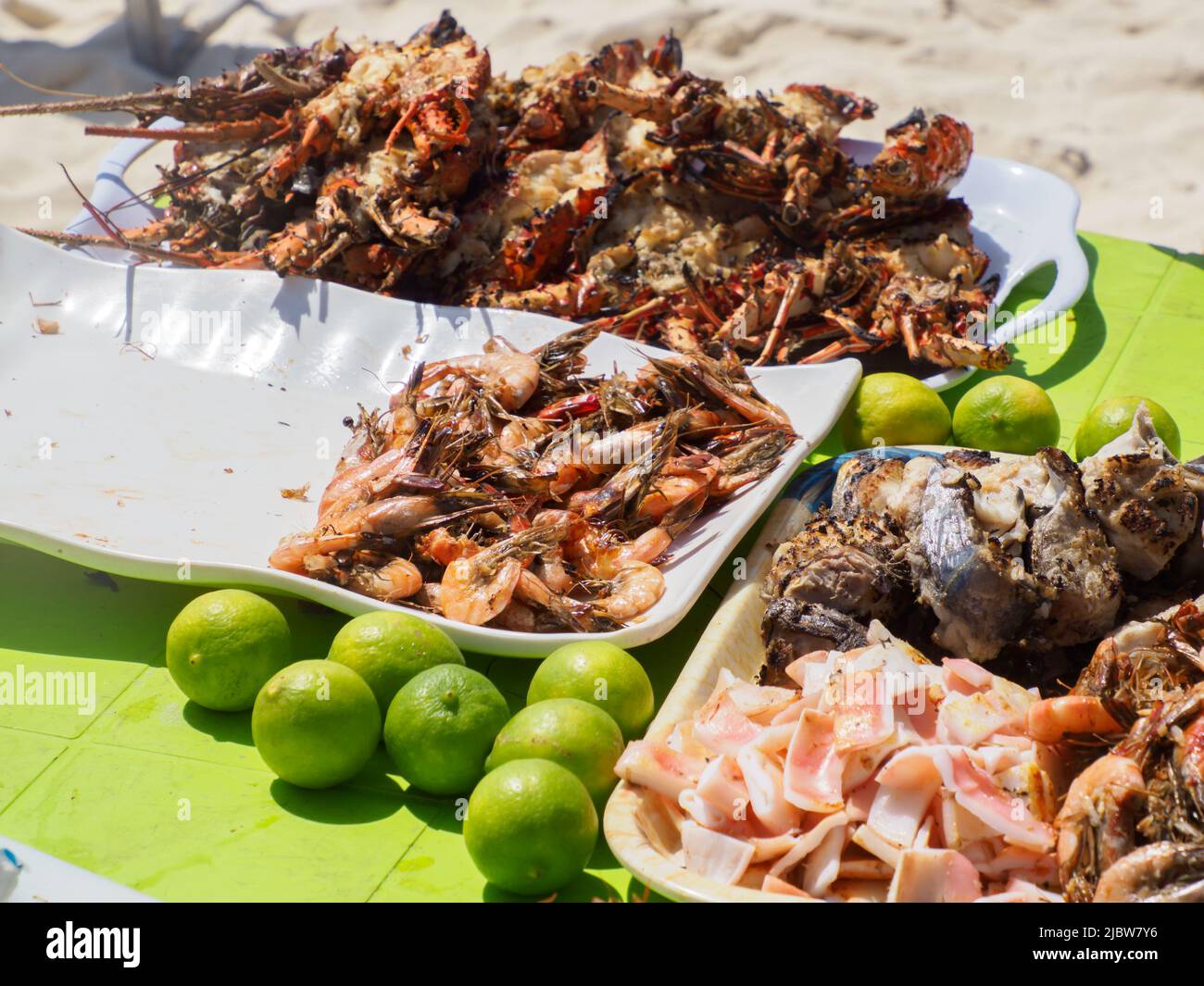 Grilled seafood served during a Blue Safari to sandbank in Menai Bay ...