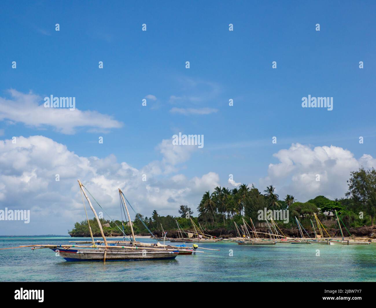 Kizimkazi, Zanzibar - Jan, 2021:Traditional dhow boats on blue water ...