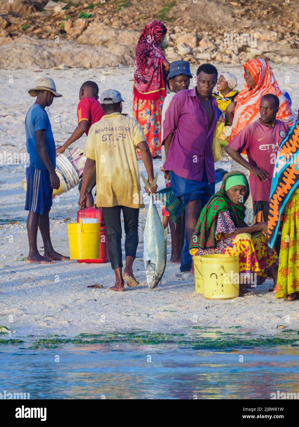 Man holding fish by its tail hi-res stock photography and images - Alamy