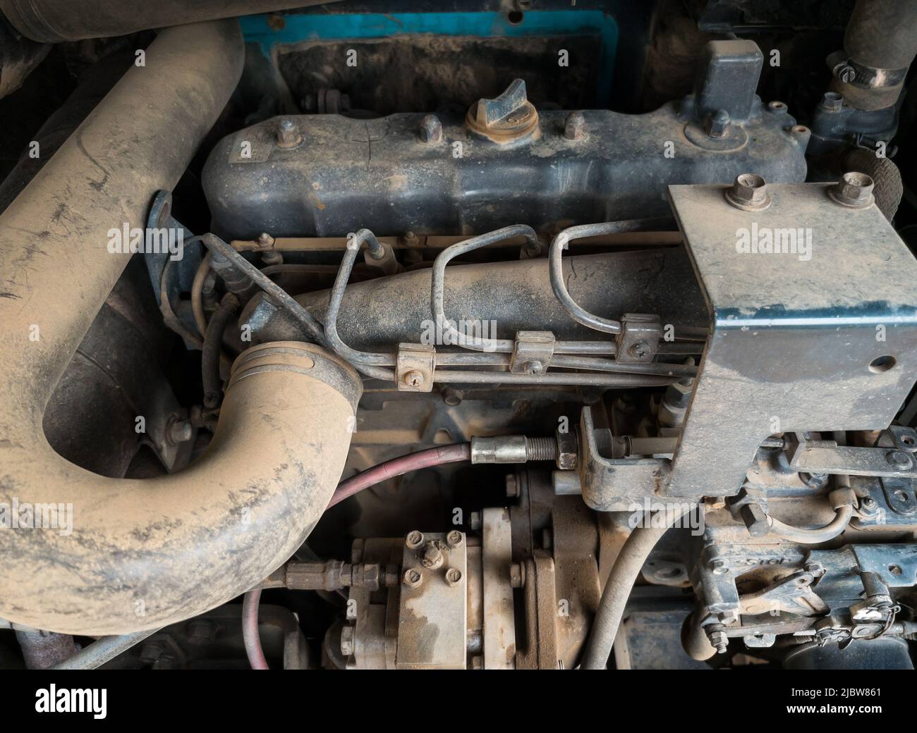 Closeup of the old tractor engine after being used on the countryside ...
