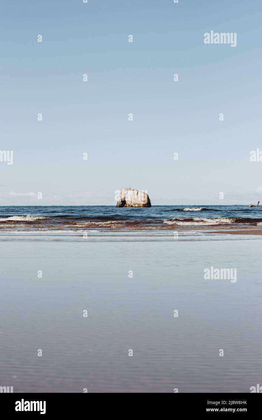 Seaside landscape in early spring day with remnants of snow in the sea ...