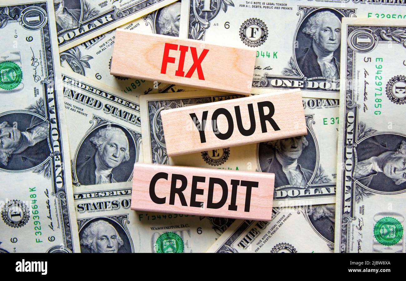 Fix your credit symbol. Concept words Fix your credit on wooden blocks ...