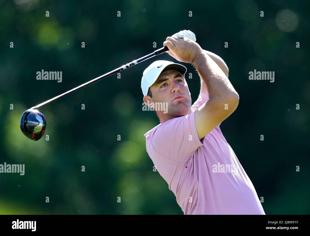 Scottie Scheffler hits his tee shot on the 18th tee box during the ...