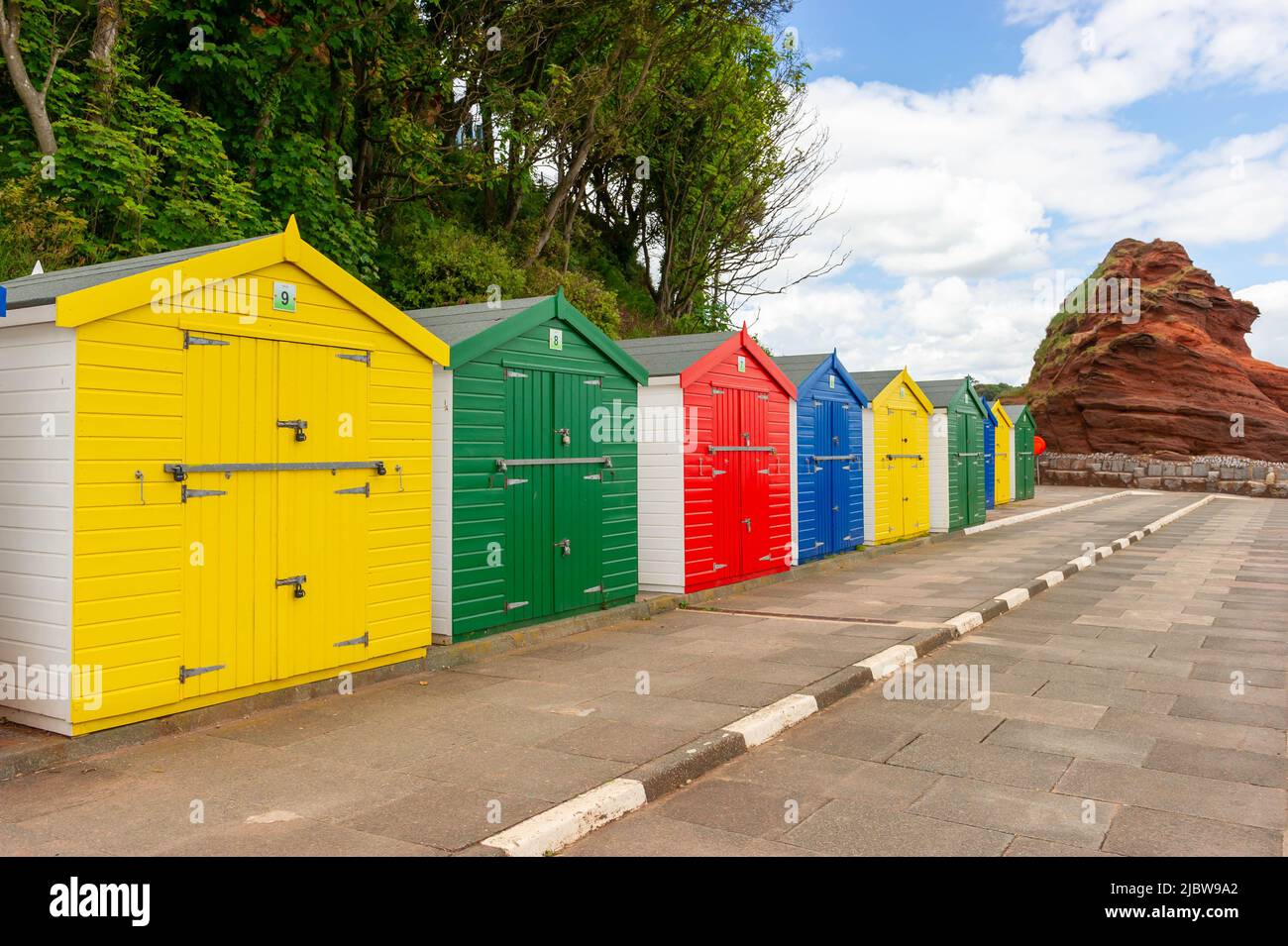 Brightly Coloured Beach Huts on the seafront at Coryton Cove, Dawlish ...