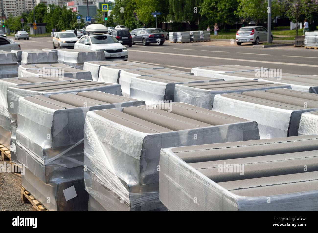 Gray curb stone in stack. Preparing to repair the road Stock Photo - Alamy