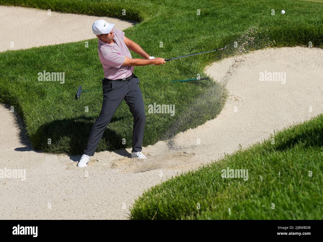 Scottie Scheffler practices out of the bunker on the 17th hole during ...