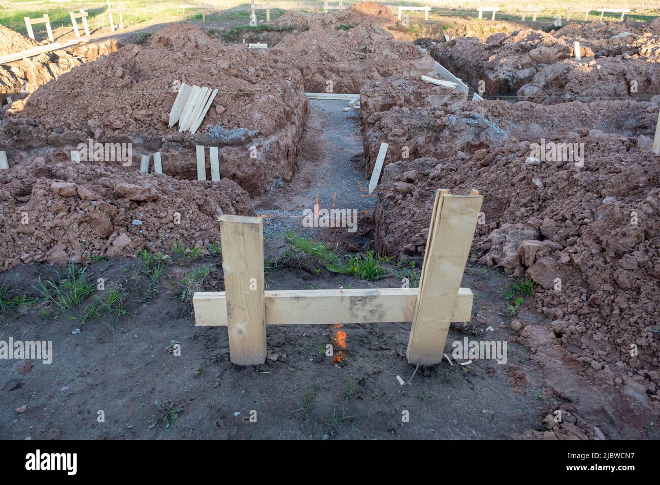 strip foundation with concrete at the construction site. start of ...