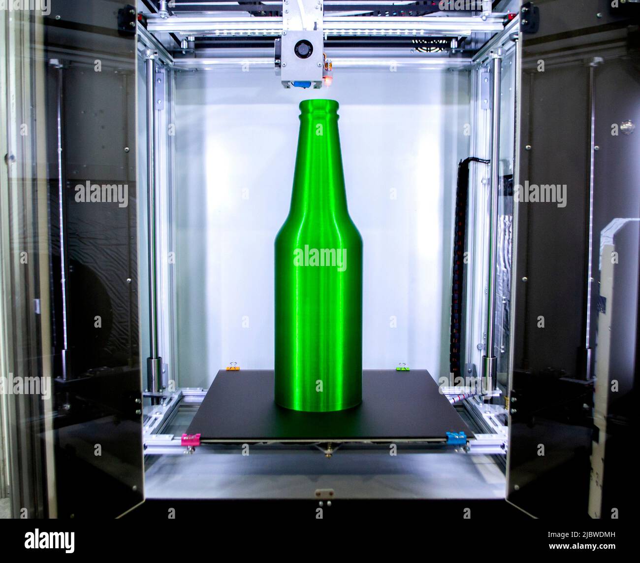 Art object printed on 3D printer are inside 3D printer on desktop. New ...