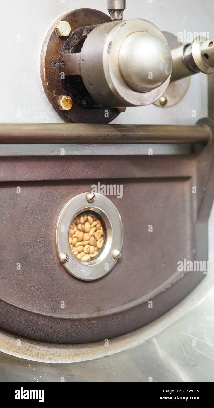 vintage old coffee roaster cooking coffee beans Stock Photo - Alamy