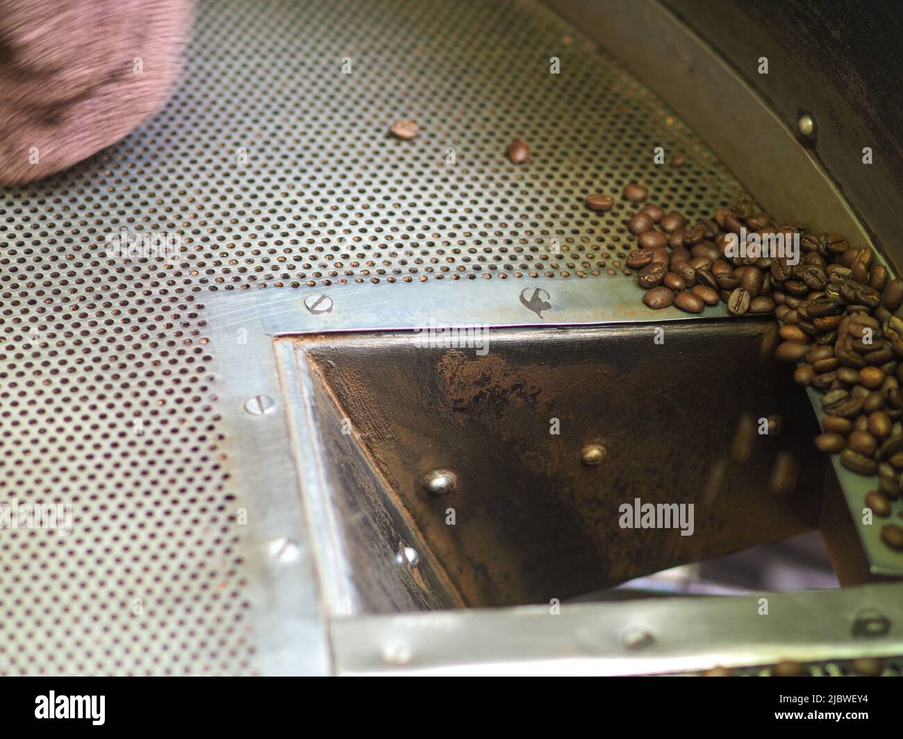 vintage old coffee roaster cooking coffee beans Stock Photo - Alamy