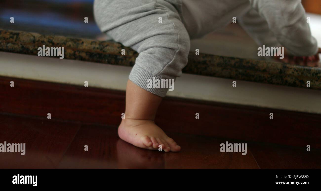 baby climbing down home step, infant development Stock Photo - Alamy