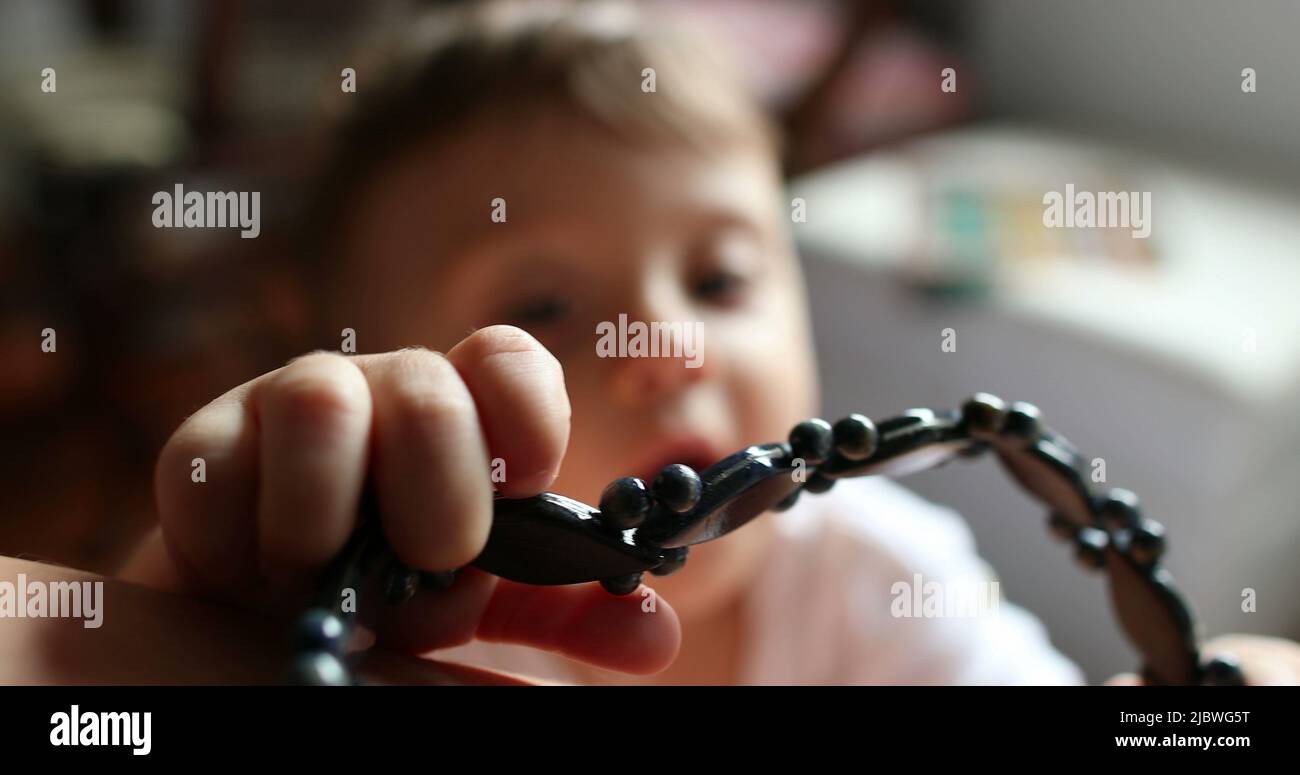 Baby infant exploring the world touching object Stock Photo - Alamy