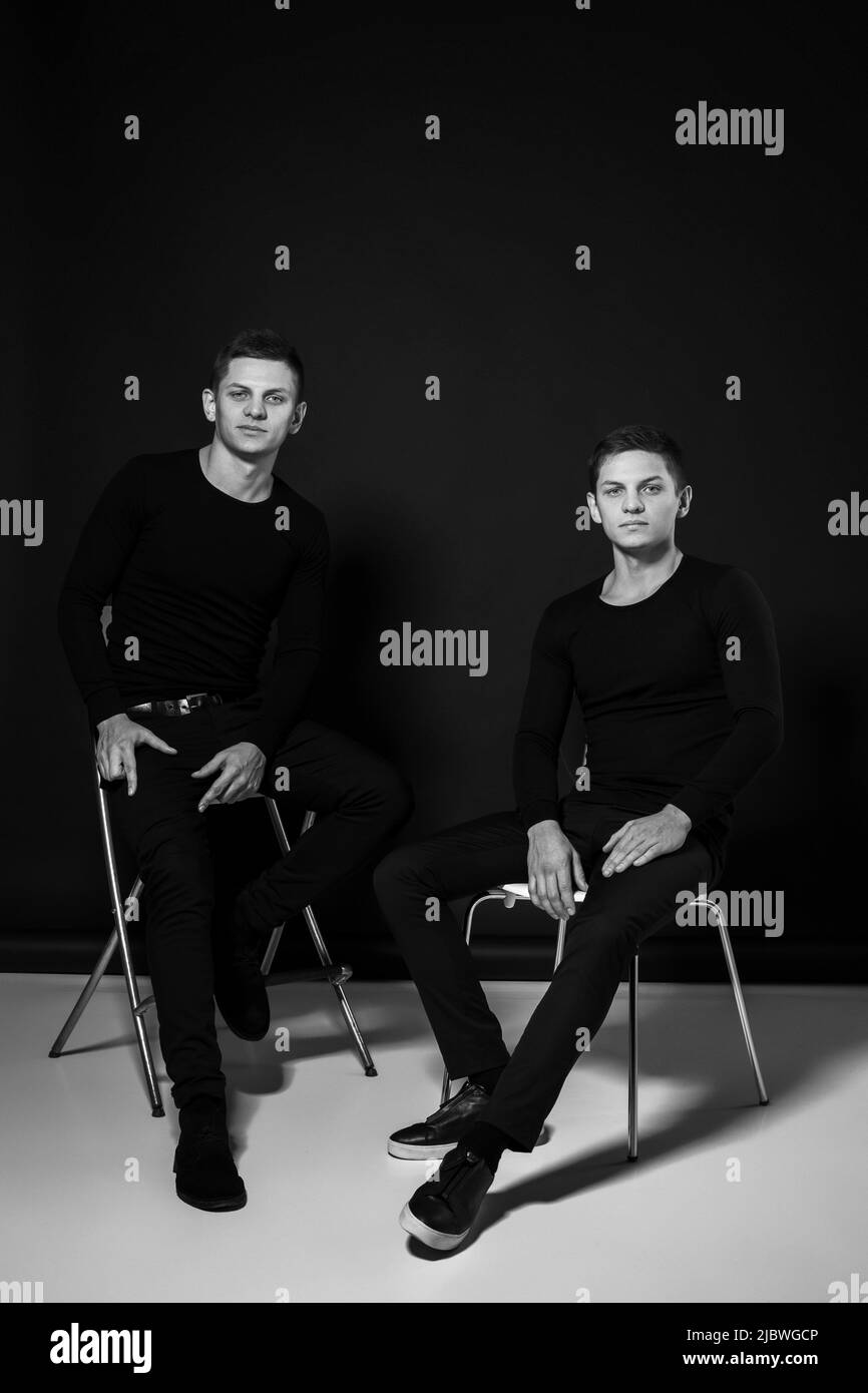 Two adult brothers Black and White Stock Photos & Images - Alamy